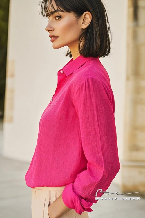The dress is a bright pink linen shirt with long sleeves and an open c ...